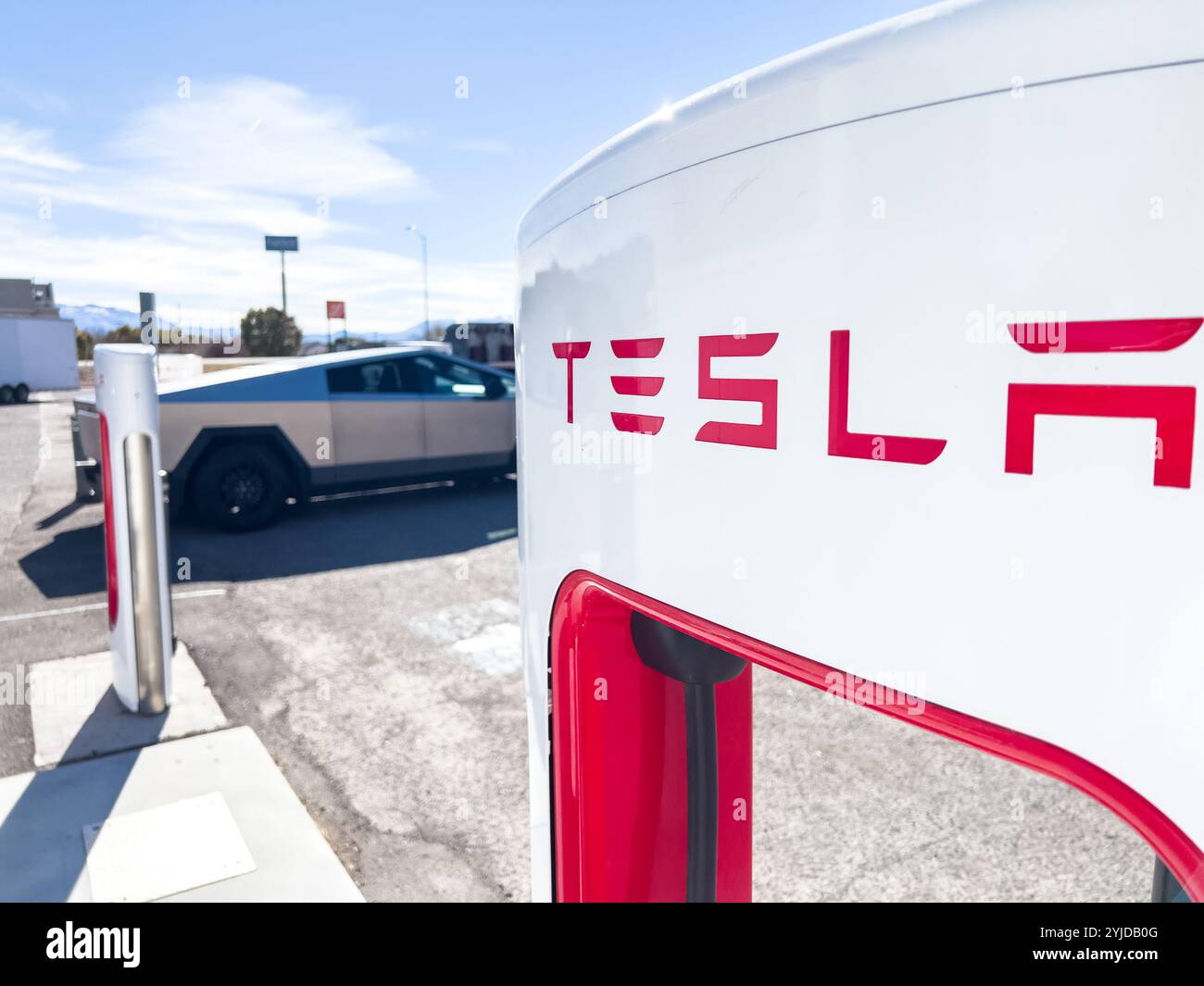 Side View of Tesla Cybertruck Charging at Supercharger Station Stock ...