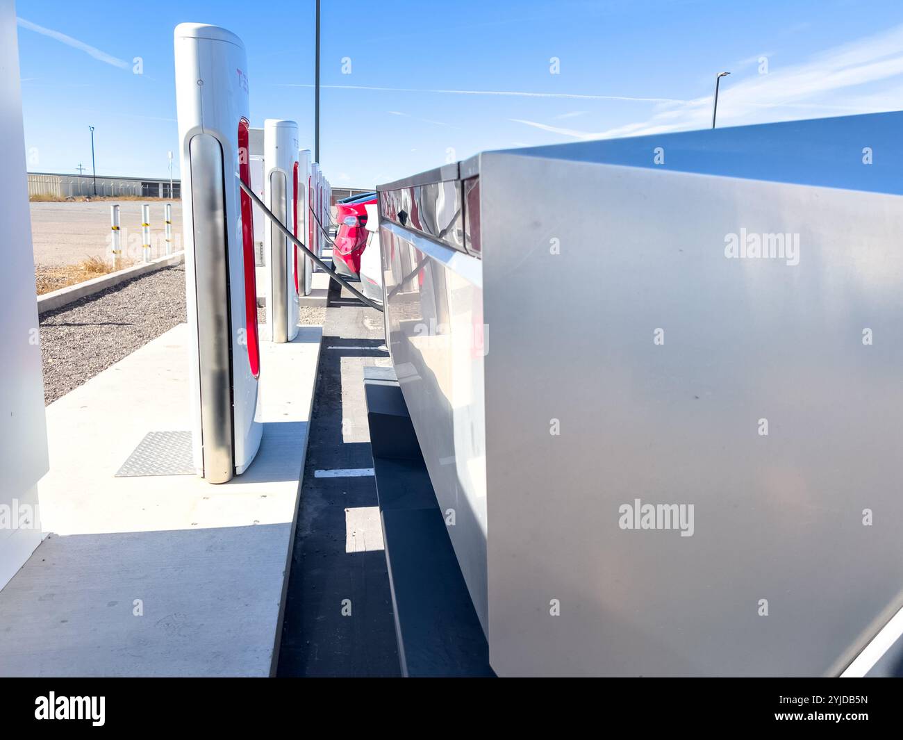 Side View of Tesla Cybertruck Charging at Supercharger Station Stock ...