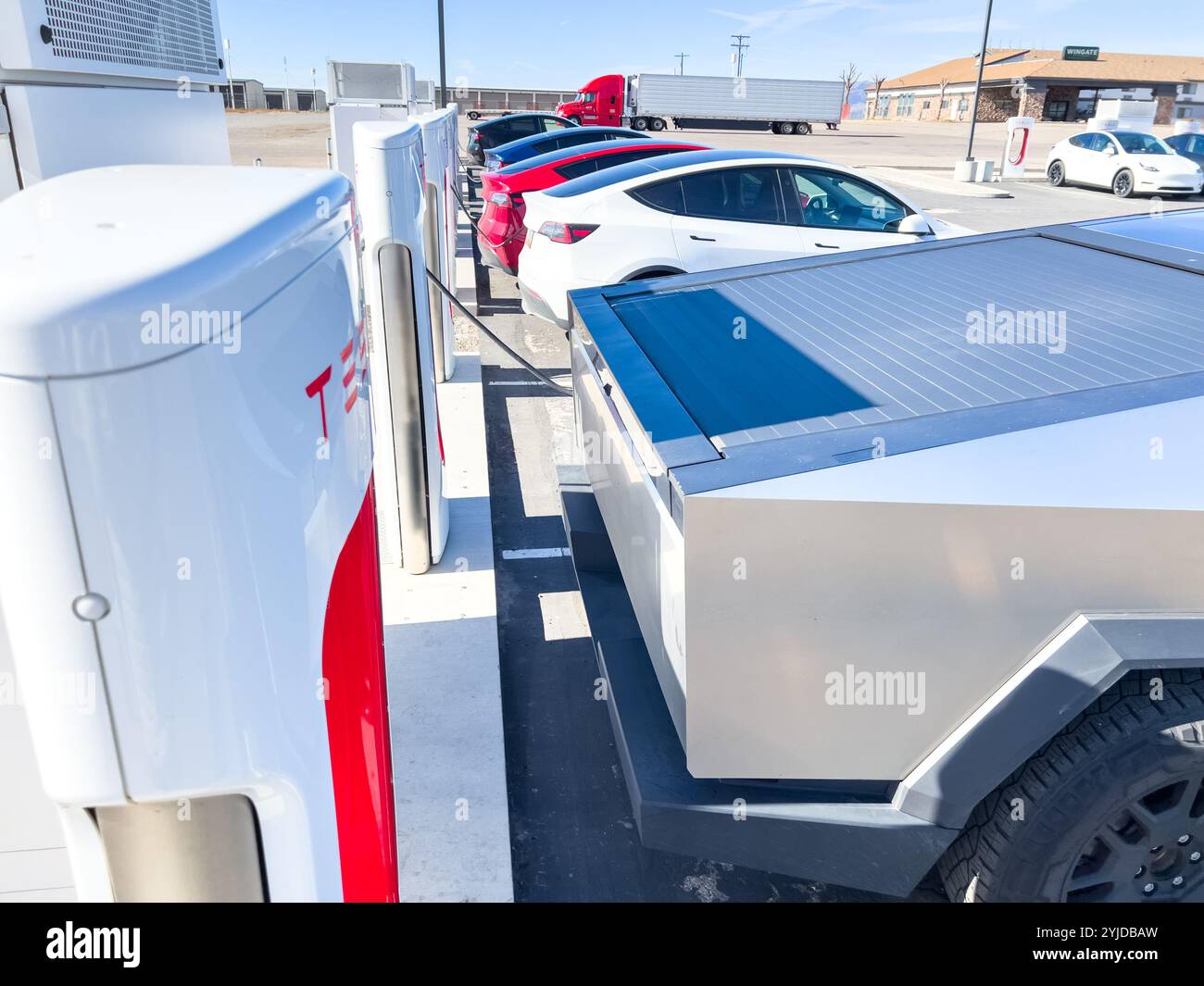 Side View of Tesla Cybertruck Charging at Supercharger Station Stock ...