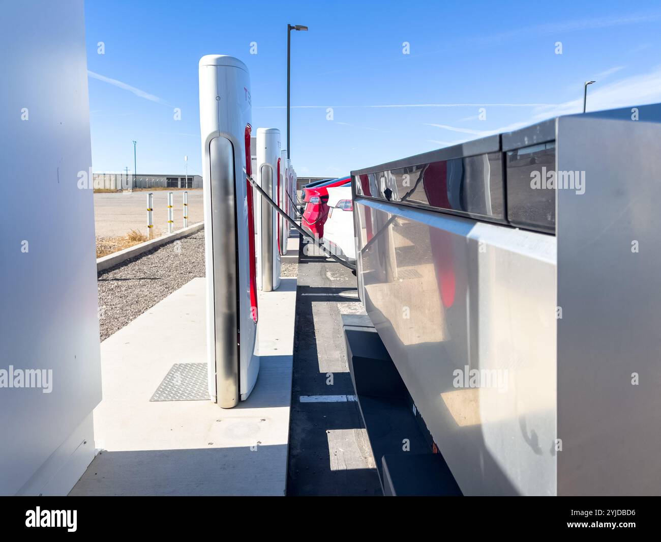 Side View of Tesla Cybertruck Charging at Supercharger Station Stock ...