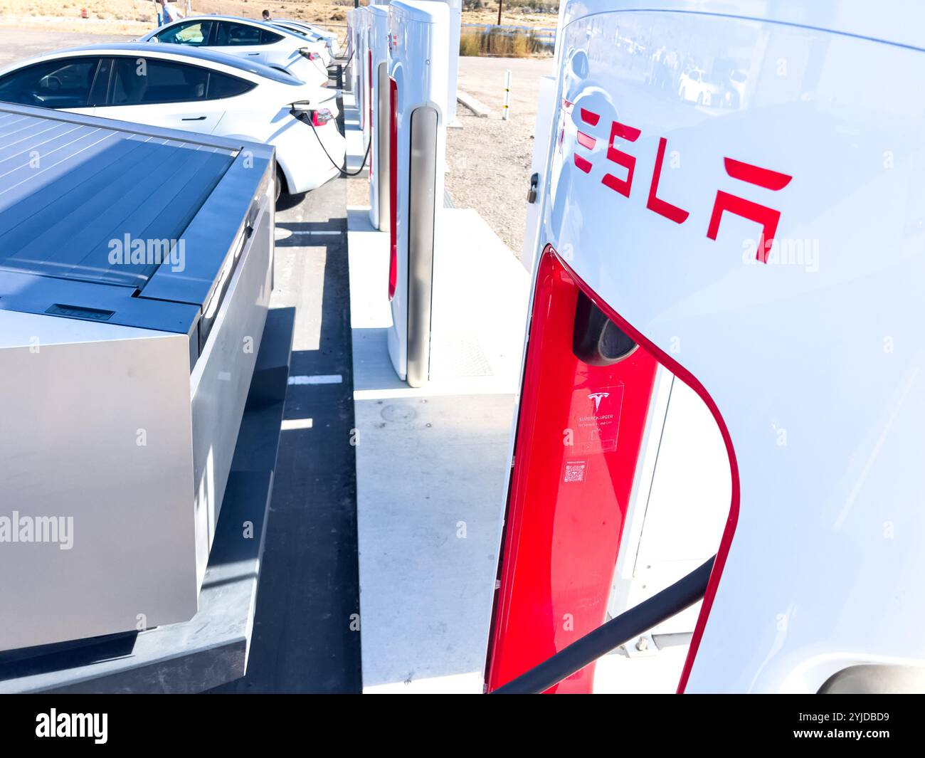 Side View of Tesla Cybertruck Charging at Supercharger Station Stock ...