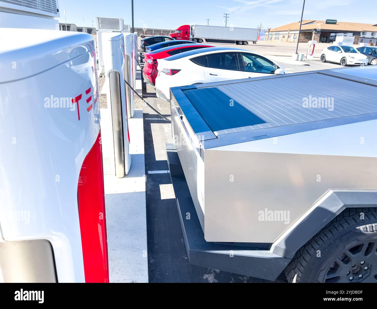 Side View of Tesla Cybertruck Charging at Supercharger Station Stock ...