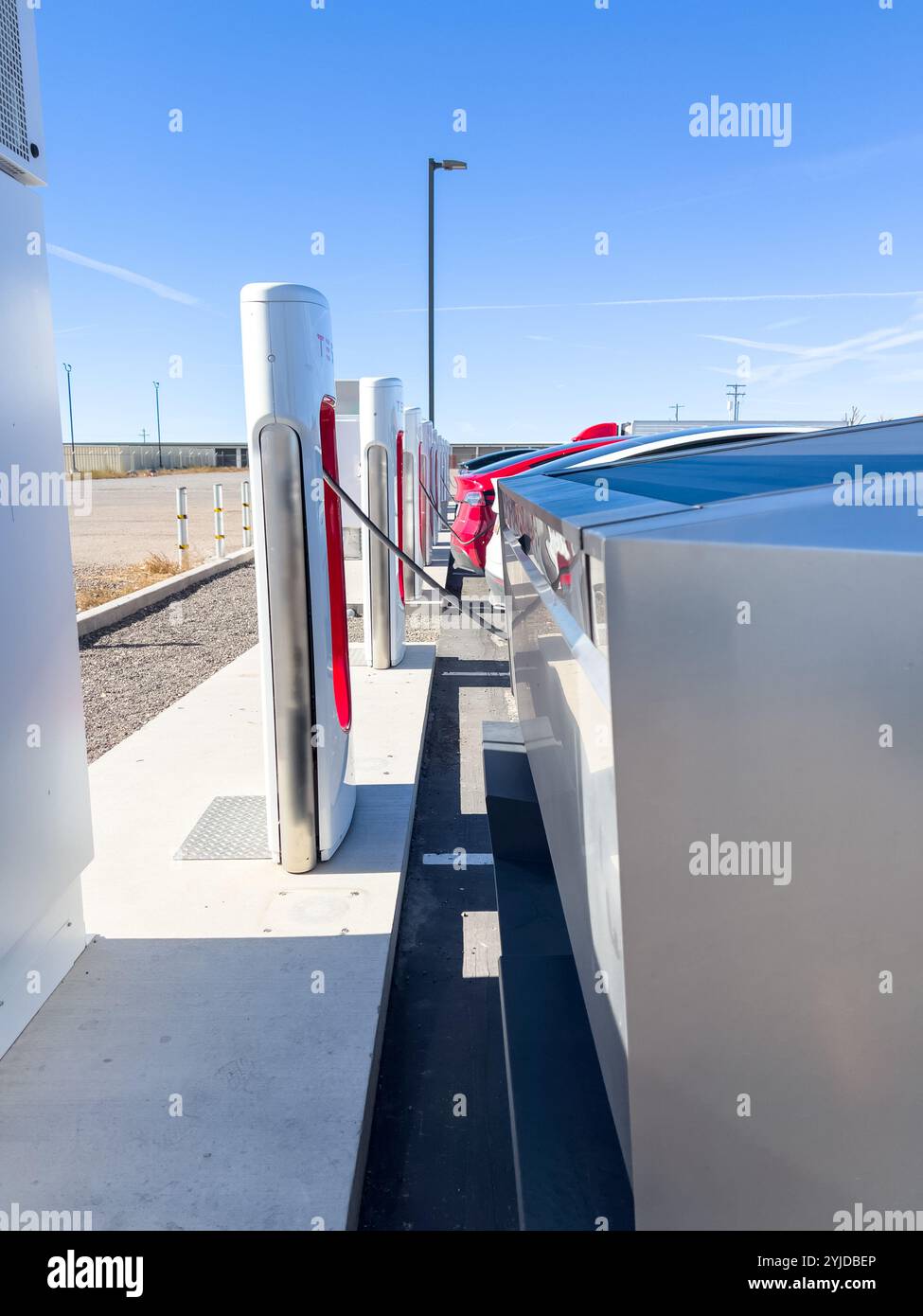Side View of Tesla Cybertruck Charging at Supercharger Station Stock ...