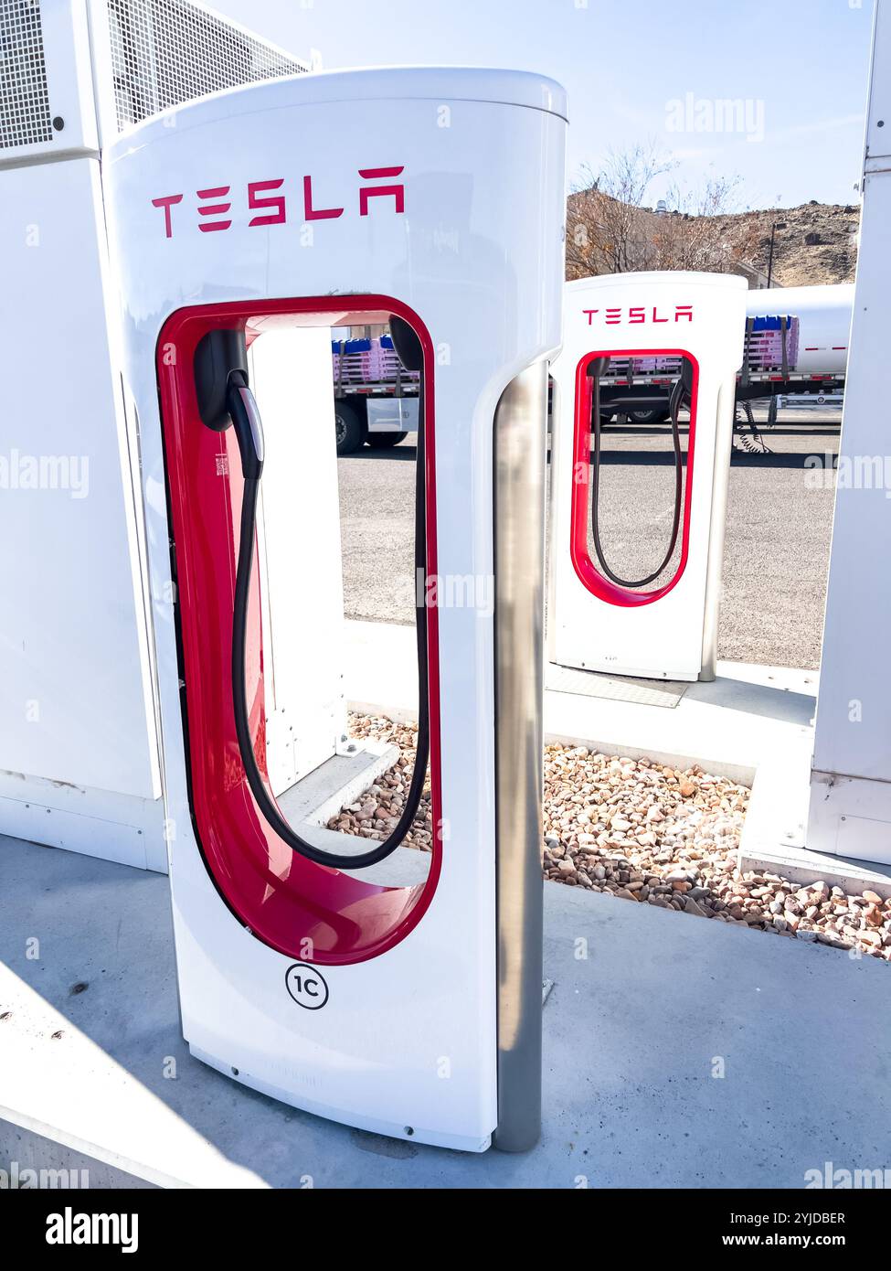 Side View of Tesla Cybertruck Charging at Supercharger Station Stock ...