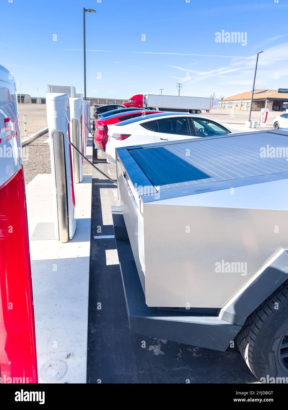 Side View of Tesla Cybertruck Charging at Supercharger Station Stock ...