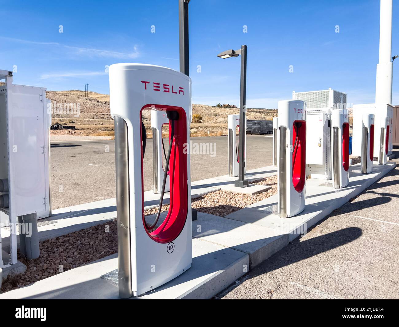 Side View of Tesla Cybertruck Charging at Supercharger Station Stock ...
