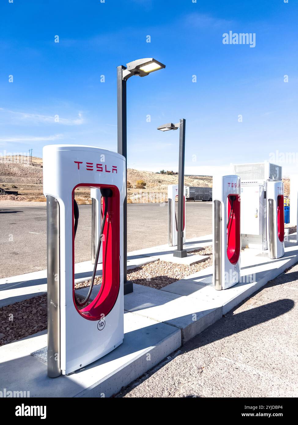 Side View of Tesla Cybertruck Charging at Supercharger Station Stock ...