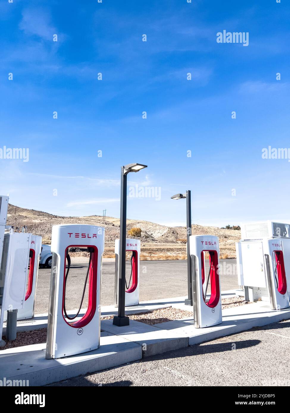 Side View of Tesla Cybertruck Charging at Supercharger Station Stock ...