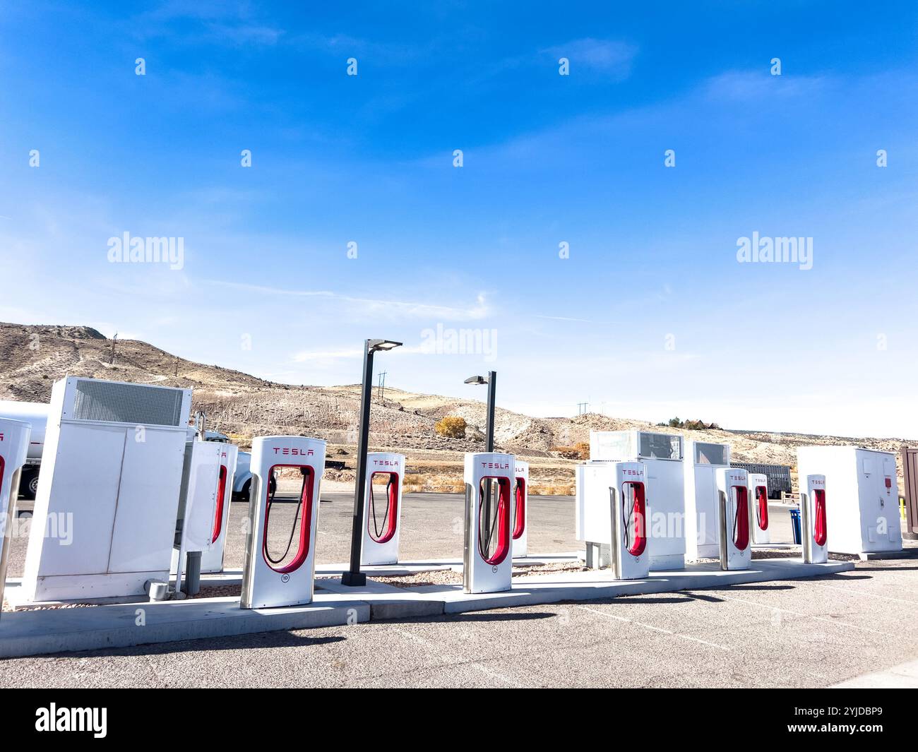 Side View of Tesla Cybertruck Charging at Supercharger Station Stock ...