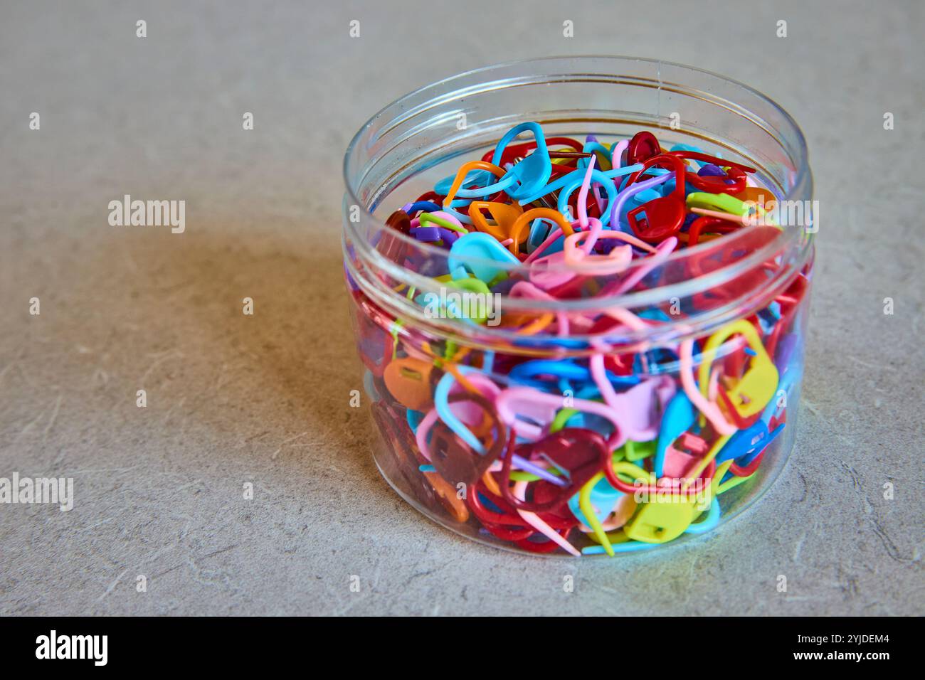 Colorful Knitting Stitch Markers in Plastic Container Eye-Level View ...