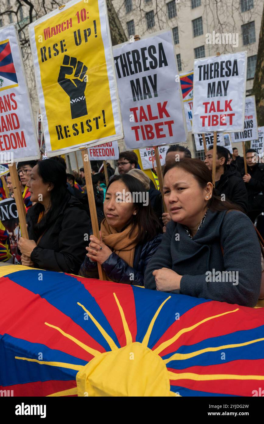 London, UK. 10th March 2018. People face Downing St with placards ...