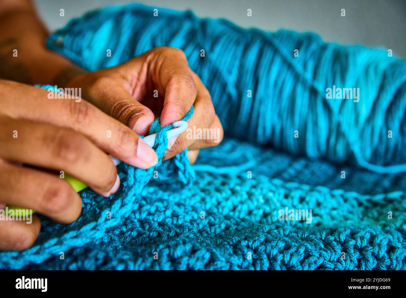 Hands Crocheting Blue Yarn with Intricate Patterns Eye Level View Stock ...