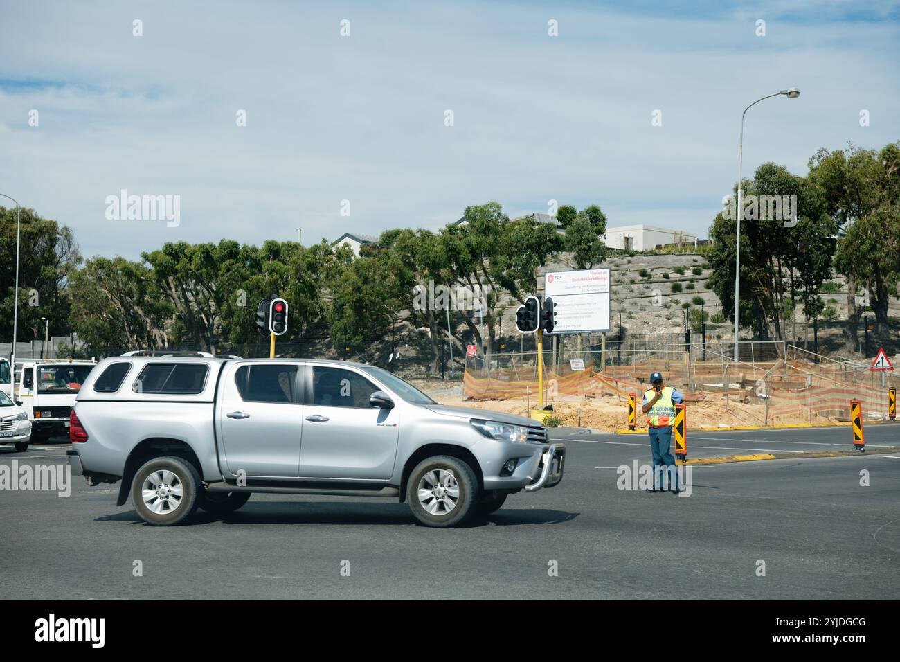 South African policeman directing directing traffic on a road near Cape ...