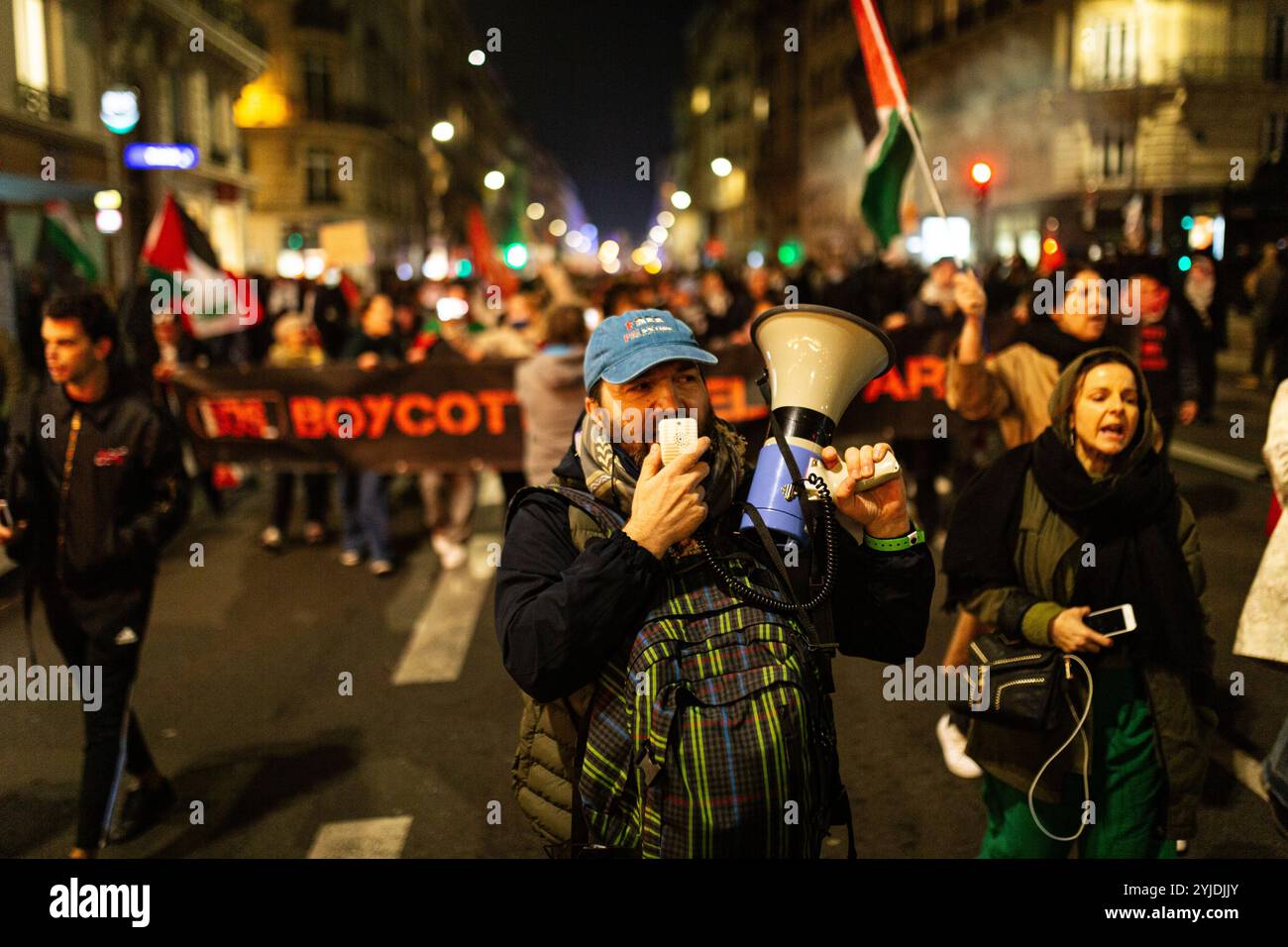 A protester chants pro-Palestinian chants into a megaphone, during the ...