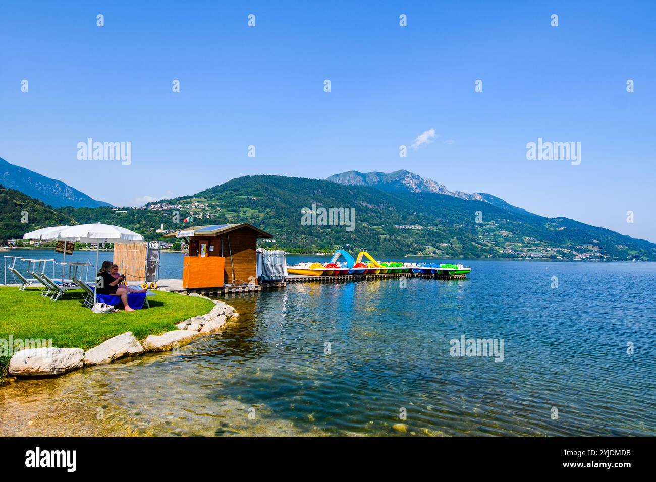LEVICO TERME, ITALY – AUGUST 26, 2024: Lake Levico, located in Trentino ...
