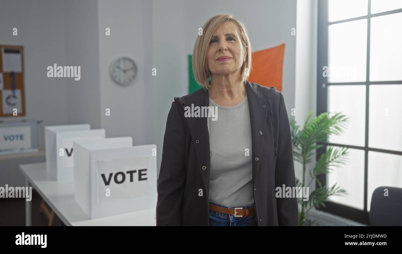 A middle-aged blonde woman stands in an indoor electoral room in ...