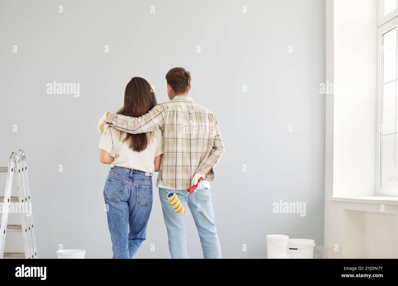 Backside View Of Family Couple Embracing And Dreaming During Home ...