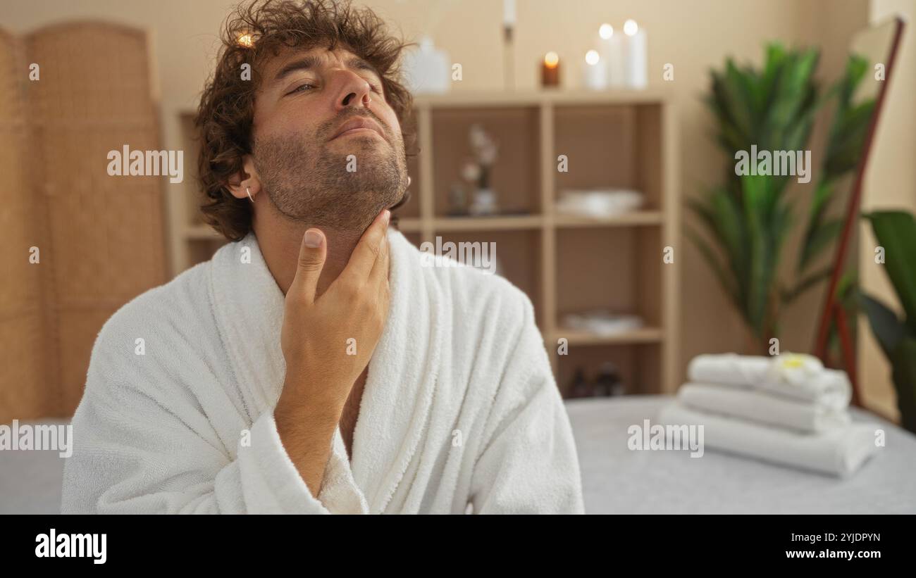 Man relaxing in a wellness spa wearing a bathrobe, surrounded by ...