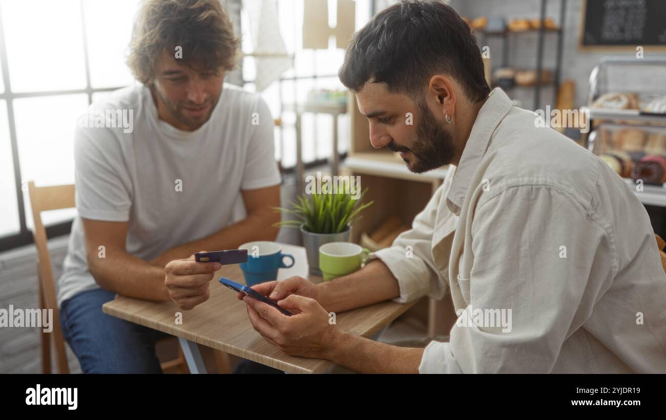 Two male friends chatting cafe hi-res stock photography and images - Alamy