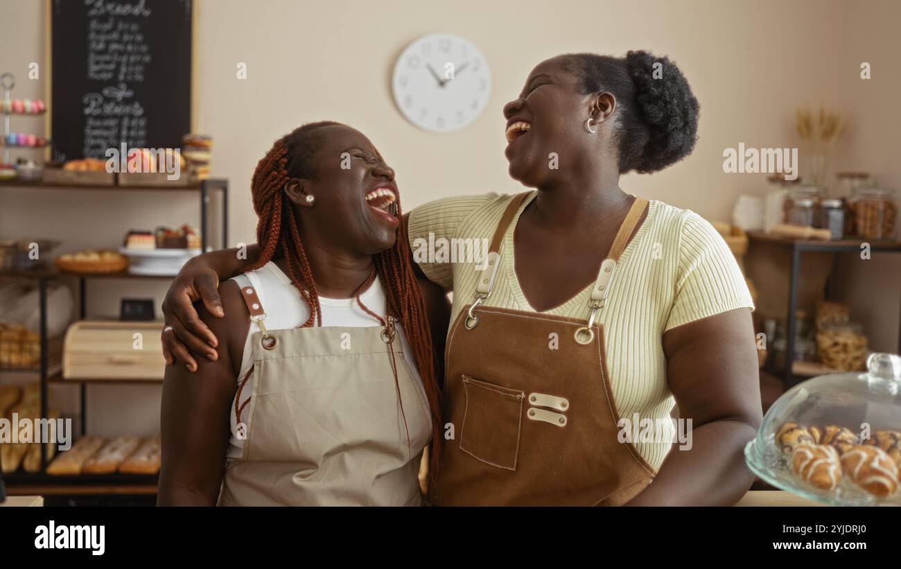 African american women bakers laughing and sharing a moment in a cozy ...