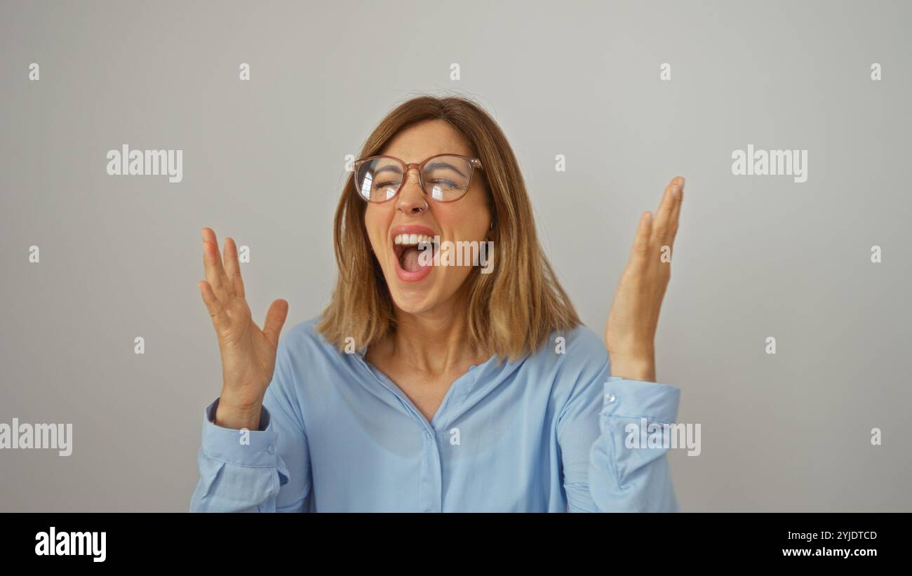 Attractive blonde woman excitedly reacting over an isolated white ...