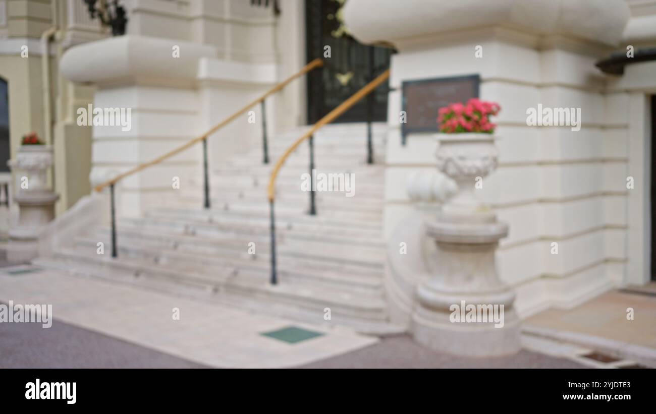Blurred image of elegant stone stairs with ornate railings and flowers ...