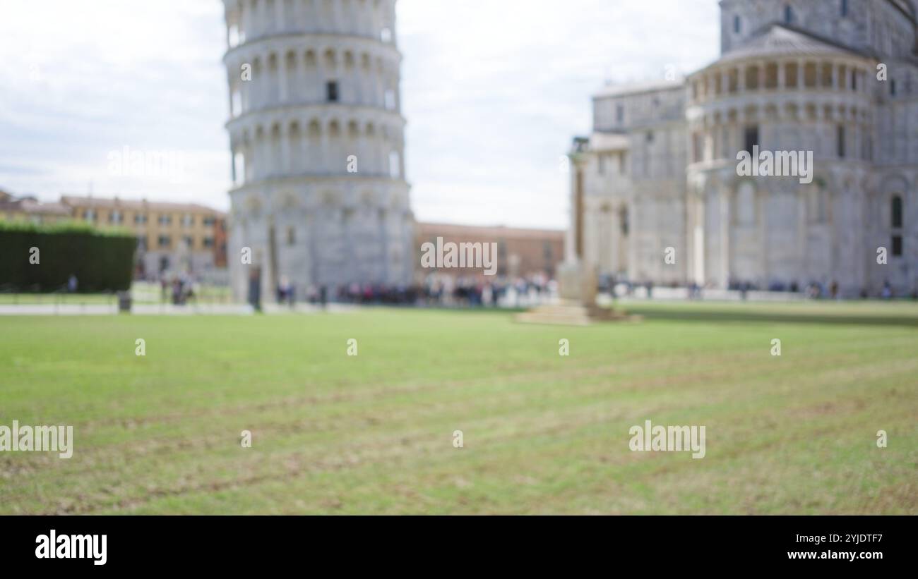 Defocused image showcasing blurred tourists exploring pisa's iconic ...