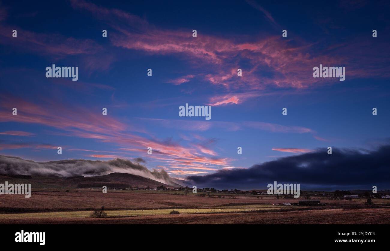 Wispy clouds at sunset over Tinto Hill in South Lanarkshire, Scotland ...