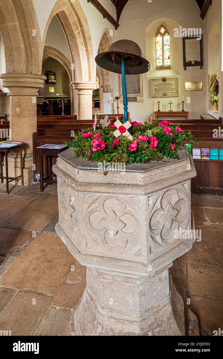 The font on Remembrance Day in St Pauls church in the Cotswold village ...