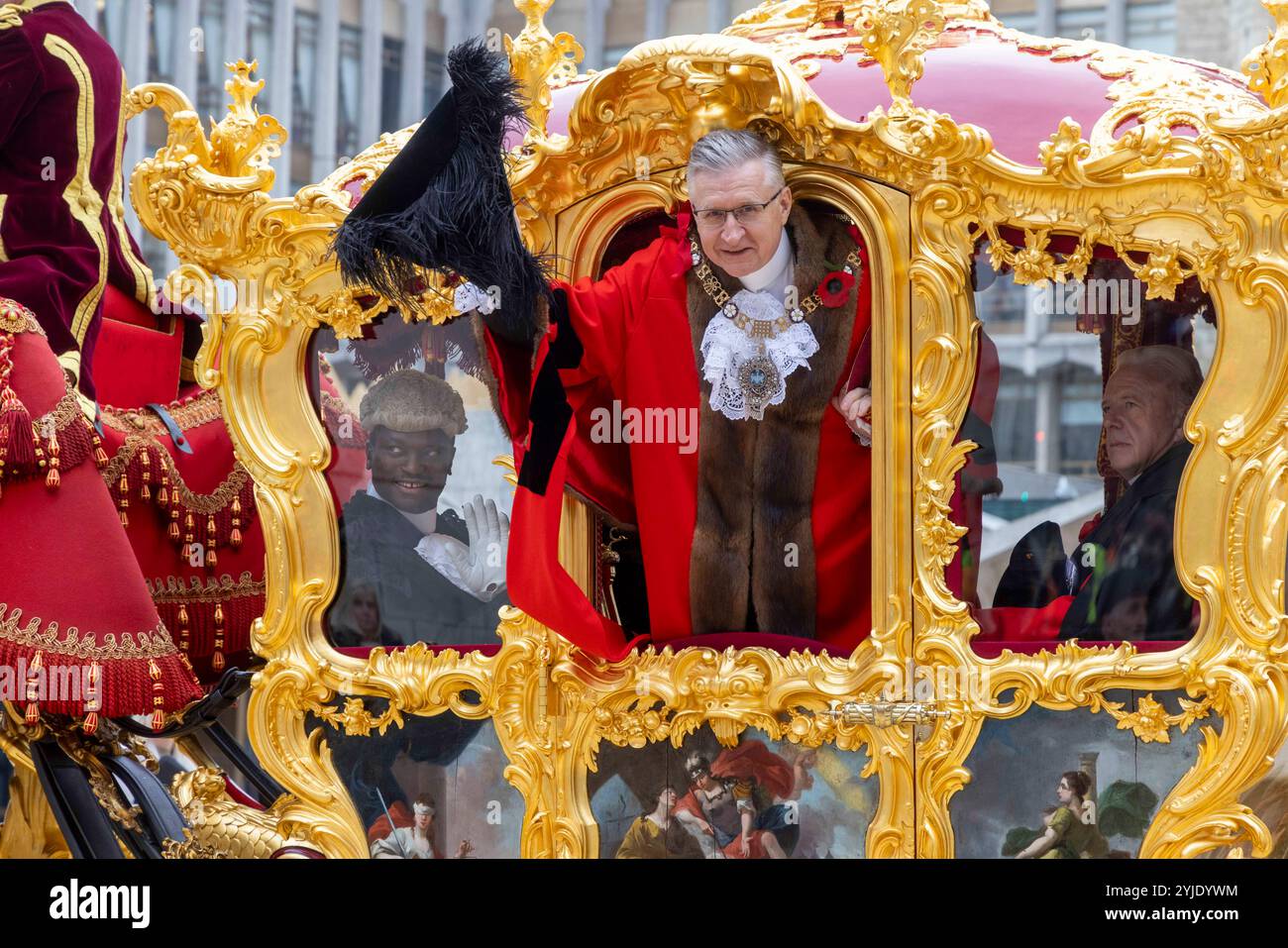 Lord Mayor of London, Alastair King, leans out of the ceremonial Gold ...