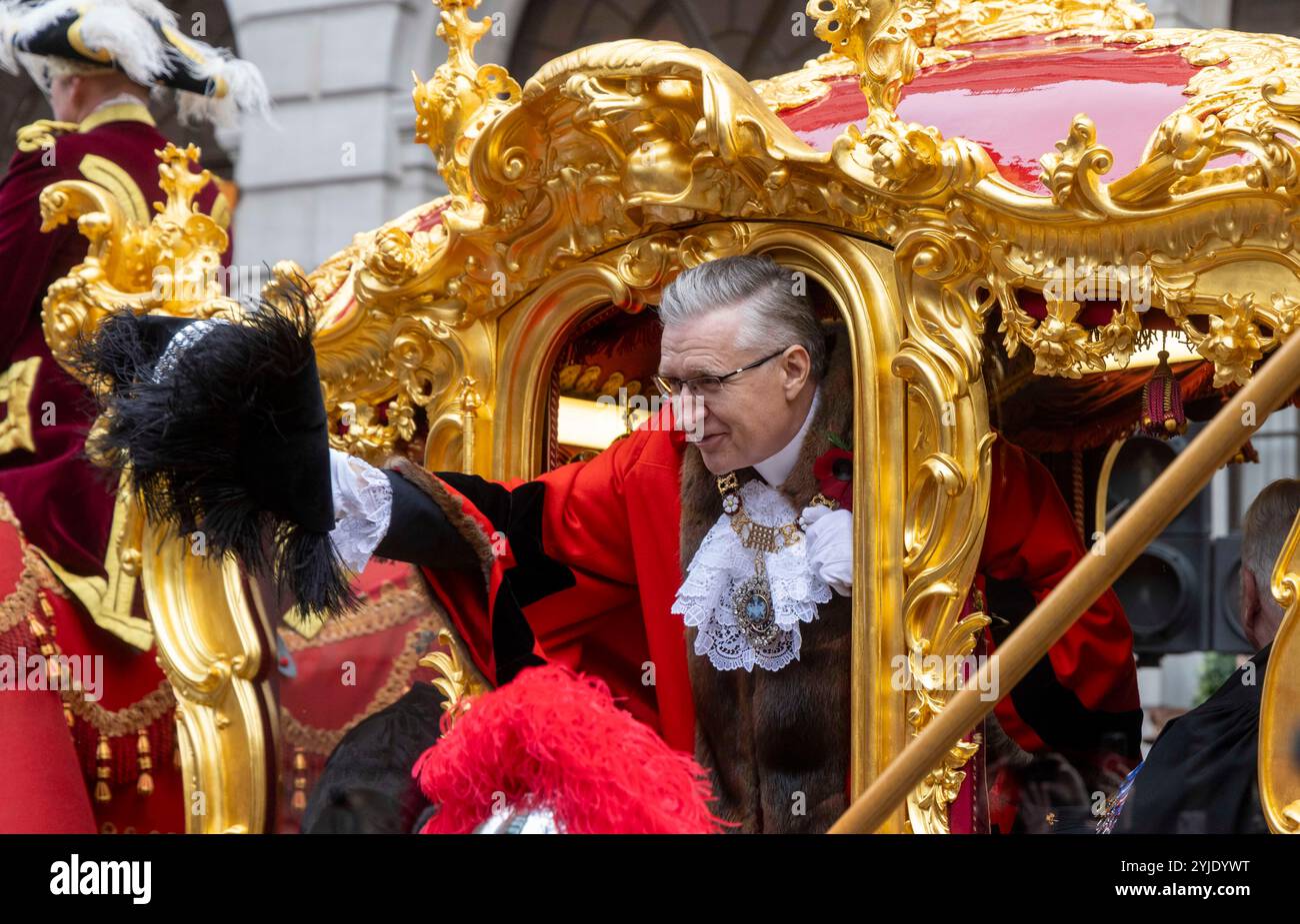 Lord Mayor of London, Alastair King, leans out of the ceremonial Gold ...