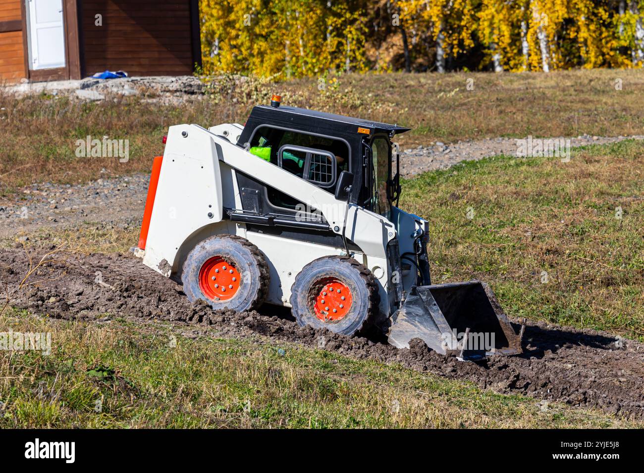 White skid steer loader hi-res stock photography and images - Alamy