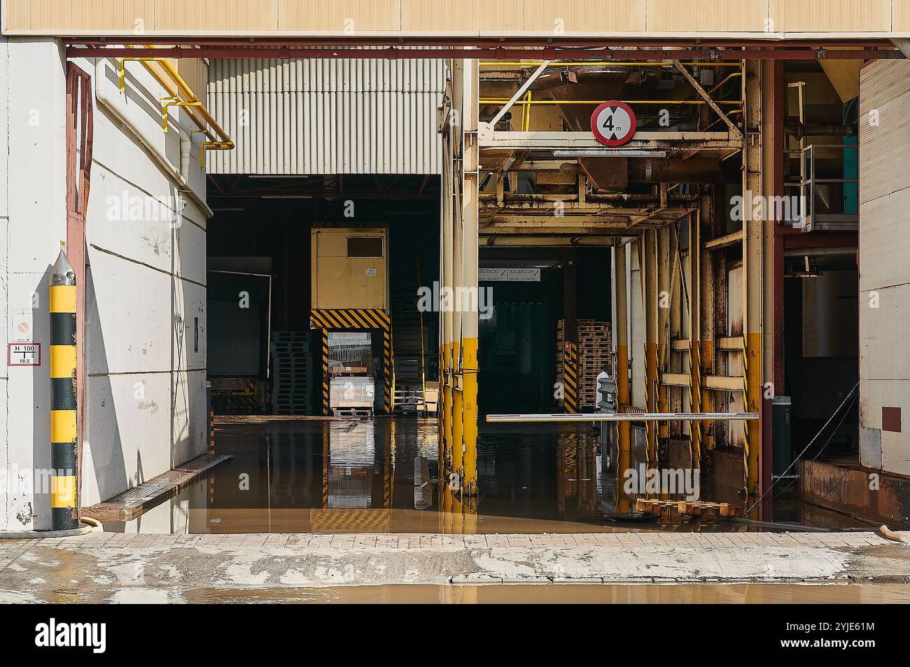 This image shows the interior of a factory completely flooded due to ...
