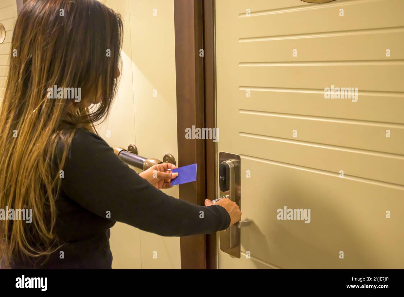 Person using a keycard to unlock a modern door, key electronic lock ...