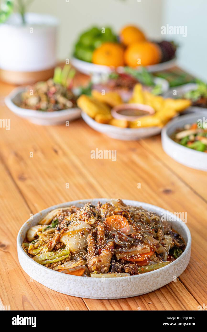 Various kinds of noodles are stir fried together with vegetables and ...