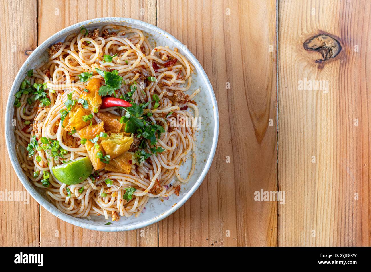 The Khao Soi Yuan Naan that is served on the plate is Khao Soi noodles ...