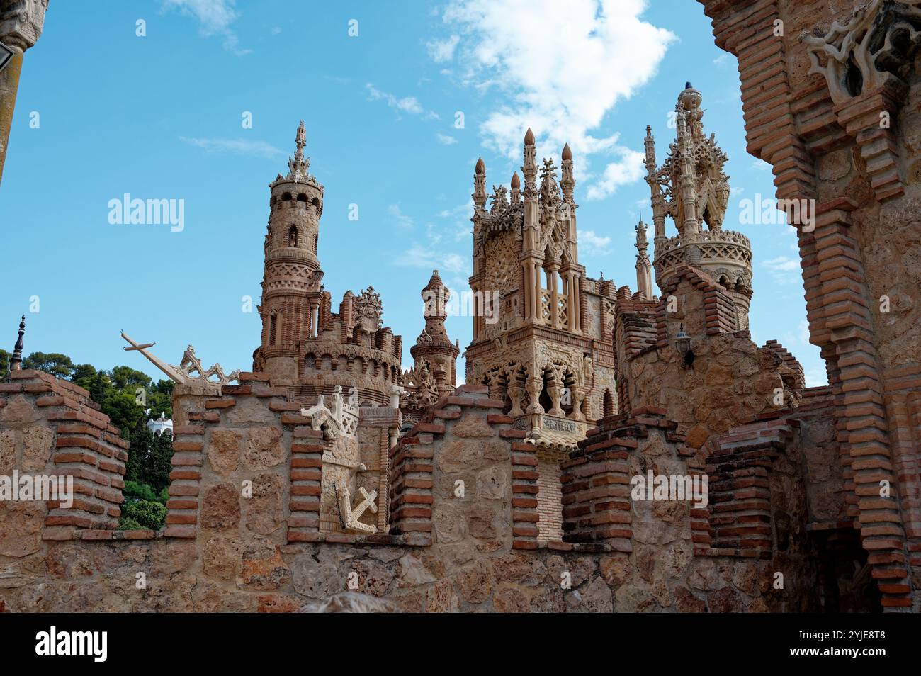 The intricate towers of Colomares castle rise above stone battlements ...