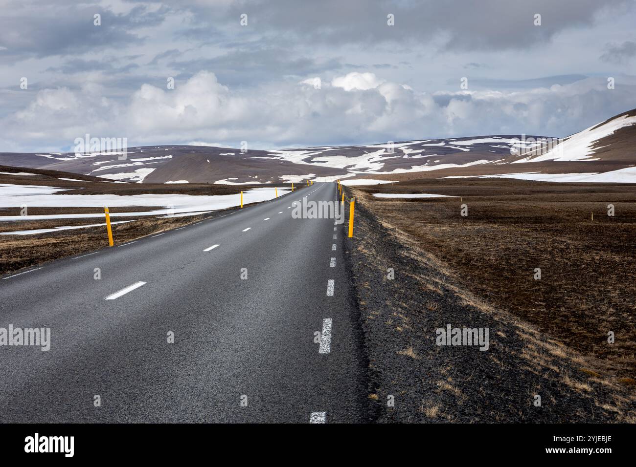 Ring road (Route 1) straight tarmac road in East Iceland with barren ...