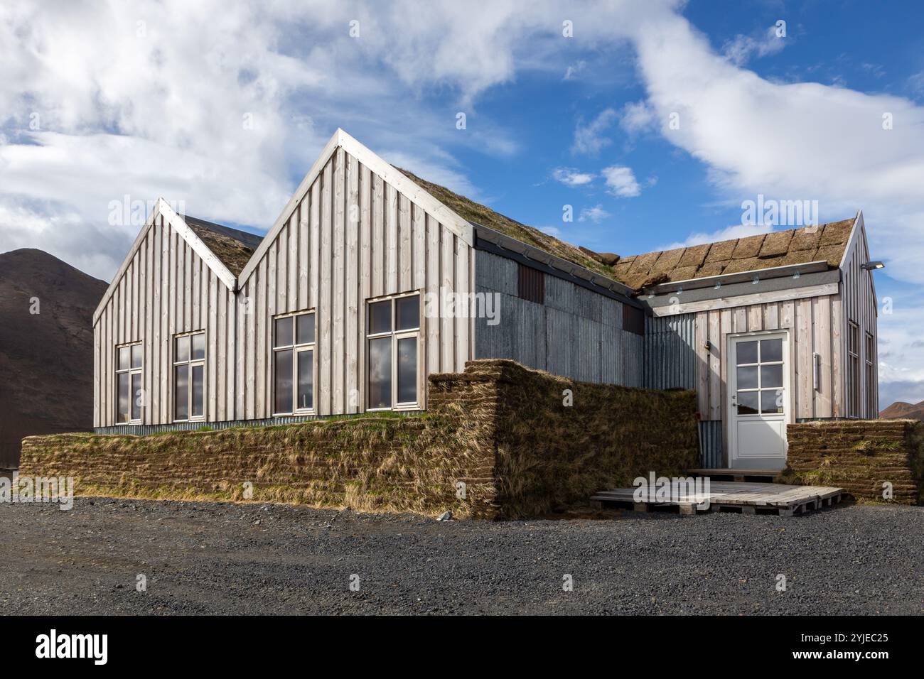 Traditional Icelandic wooden building with turf covered roof, grey ...