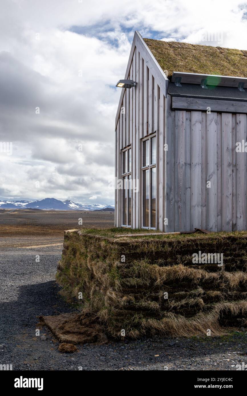 Traditional Icelandic wooden building with turf covered roof, grey ...