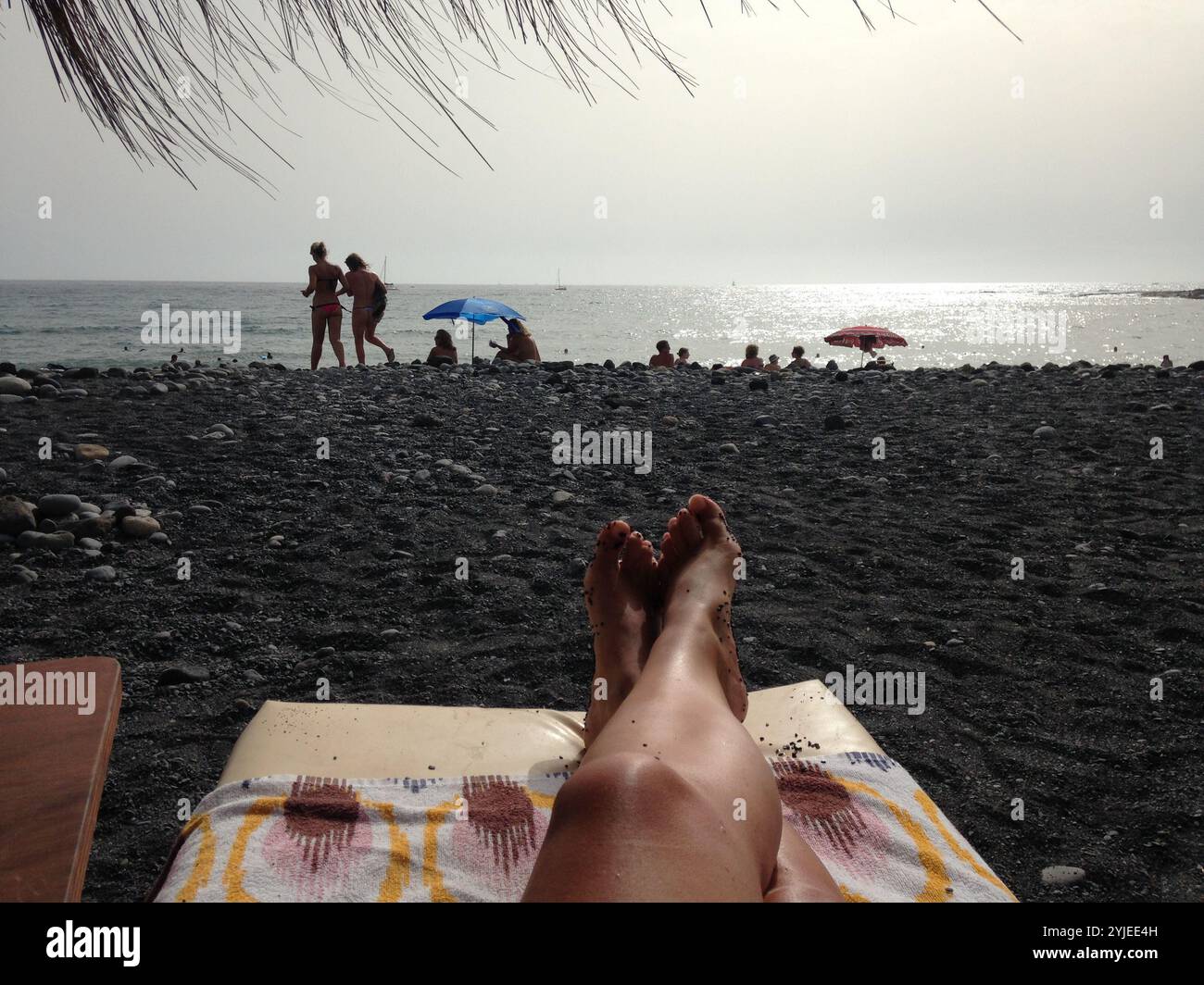 Relaxing Beach Scene With Black Sand And Ocean View Stock Photo - Alamy
