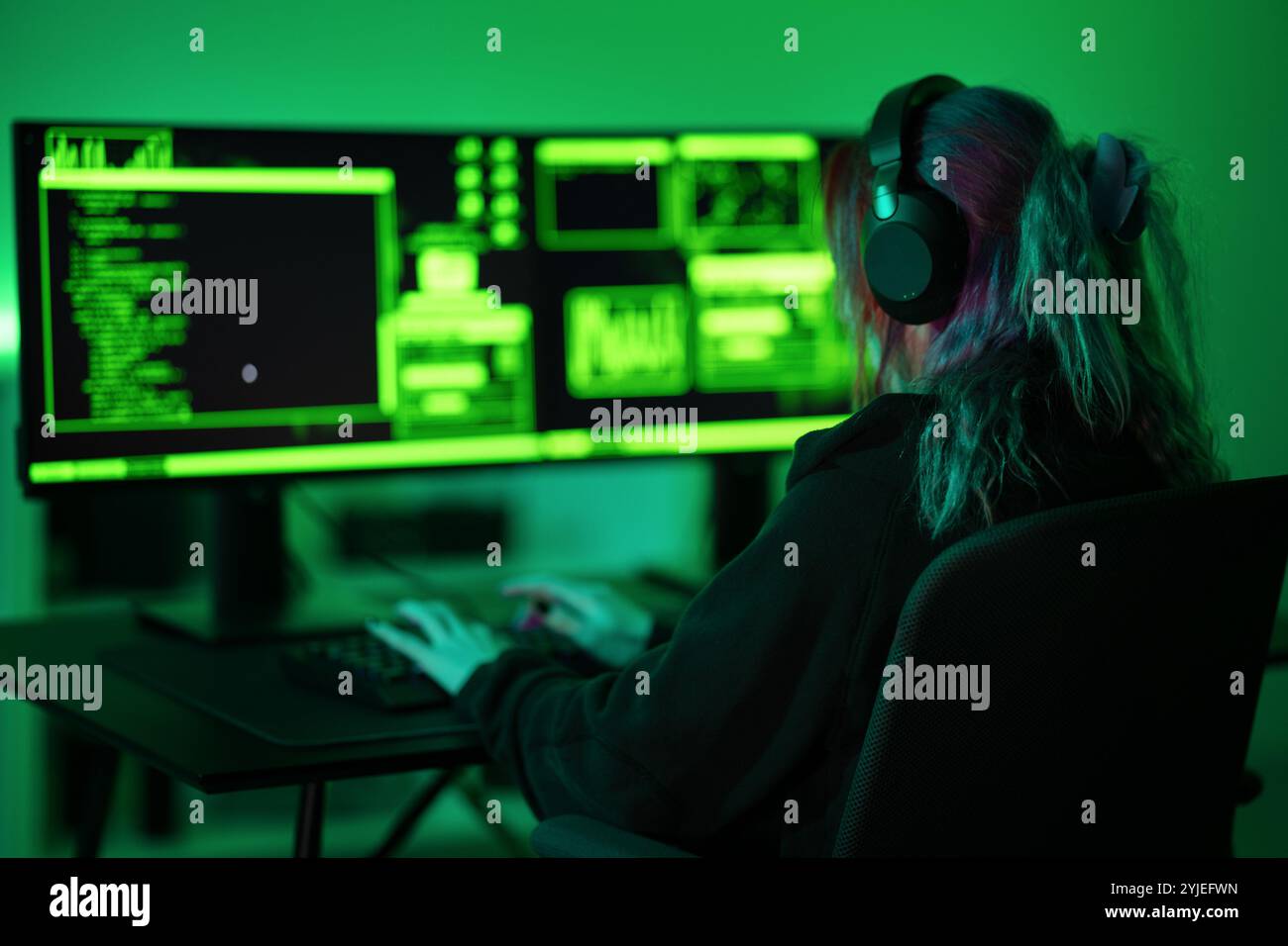 Intense cyber security monitoring with a hacker in action Stock Photo ...