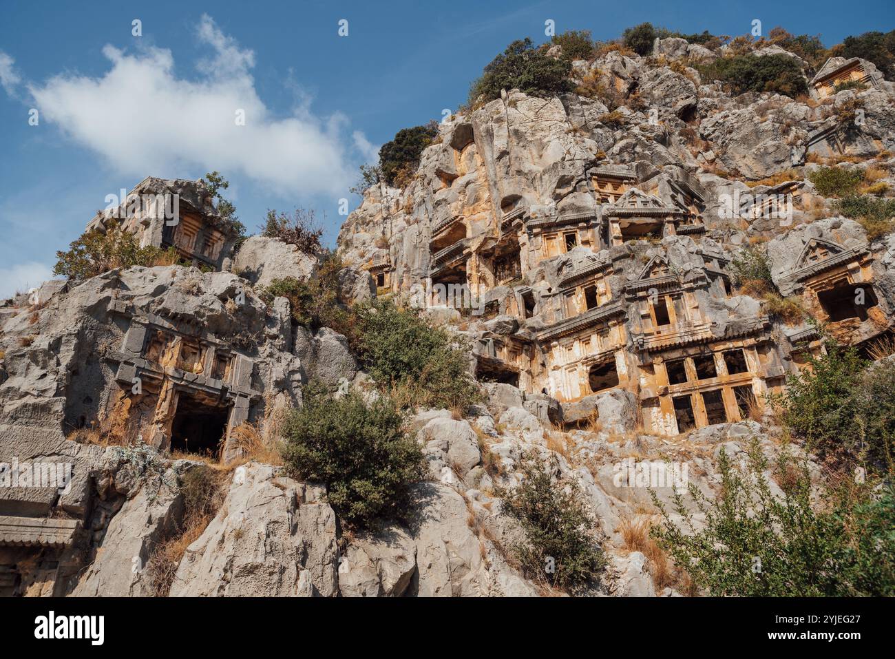 Ancient Lycian rock-cut tombs in Myra, Turkey carved directly into ...
