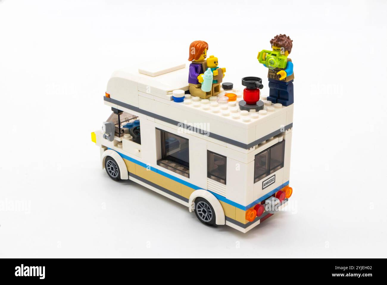 lego Toy camper van model with mini figurines depicting a family ...