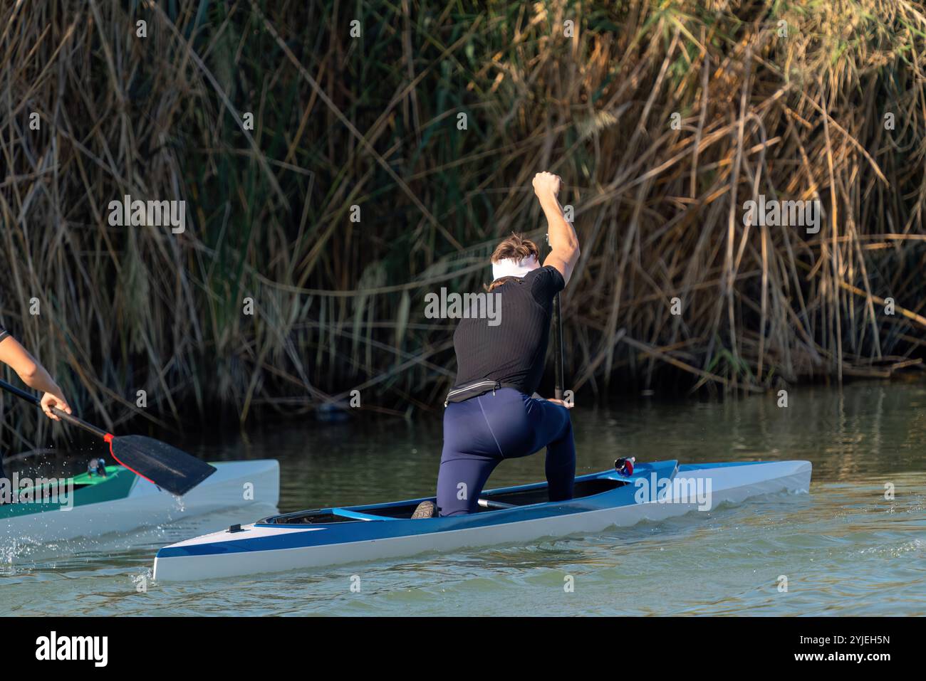 Man oarsman rowing canoe hi-res stock photography and images - Alamy