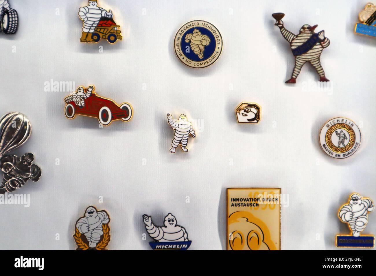 Vintage Michelin badges featuring their mascot Bibendum Stock Photo - Alamy