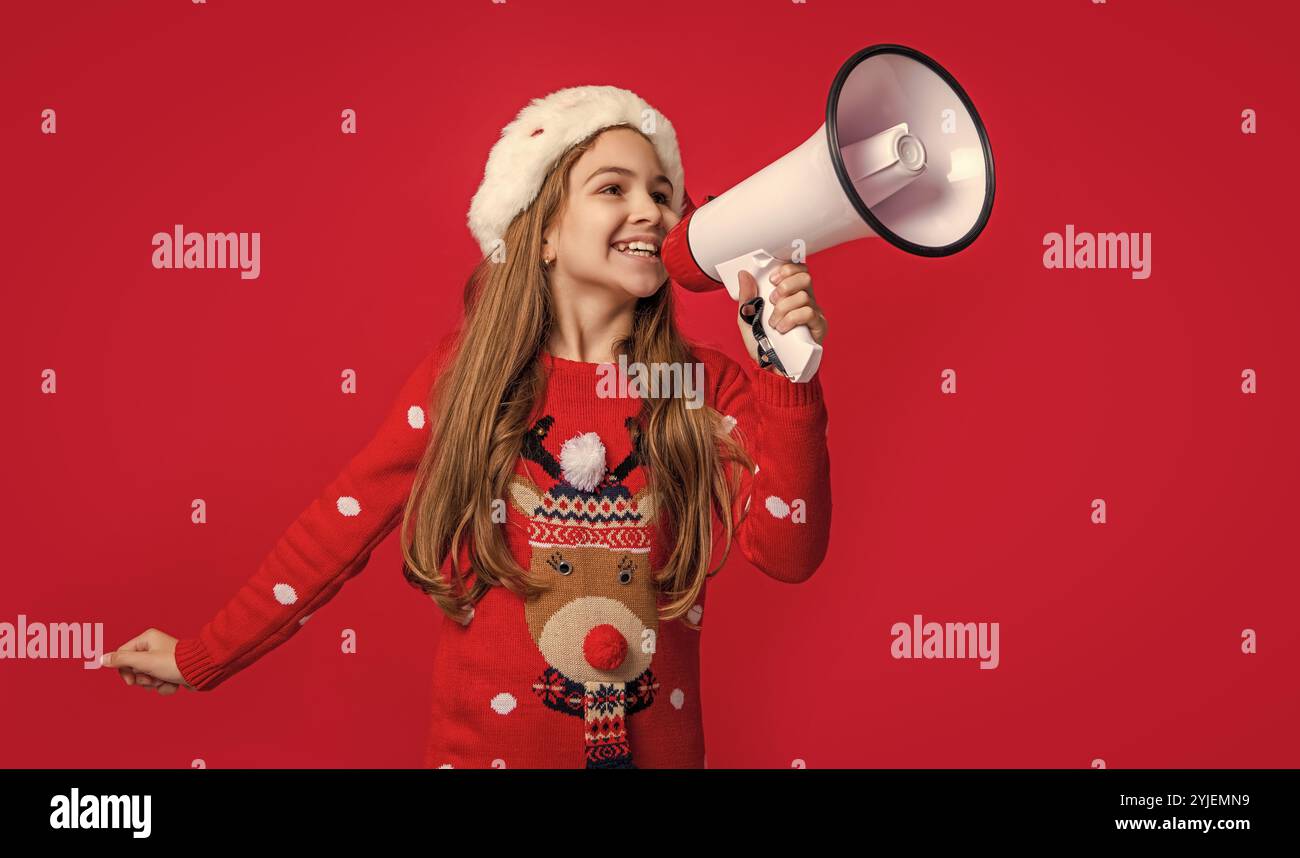 glad teen girl hold loudspeaker at christmas sale. merry christmas ...