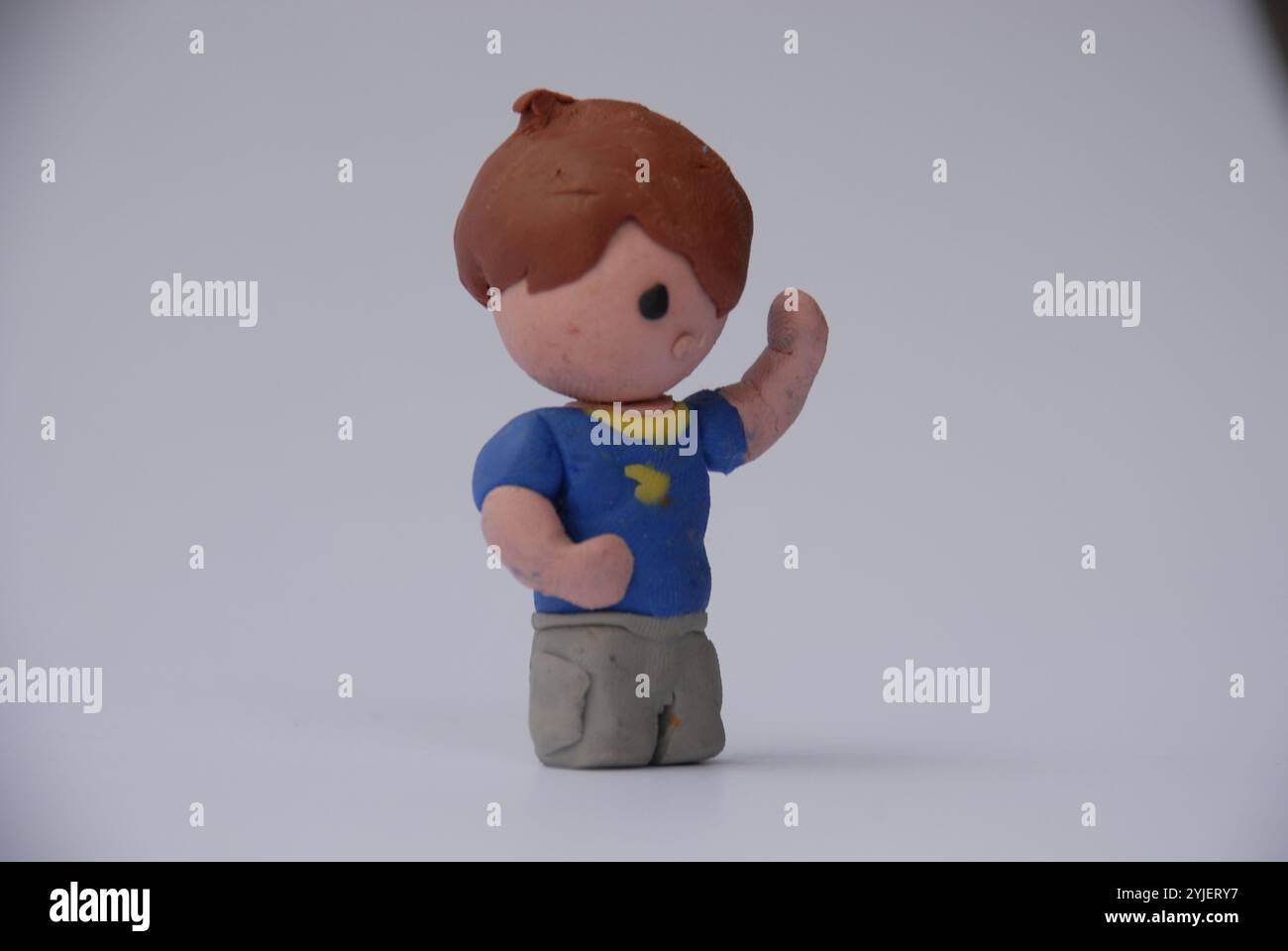 3D rendering in stylized clay of young man with brown hair and blue t ...