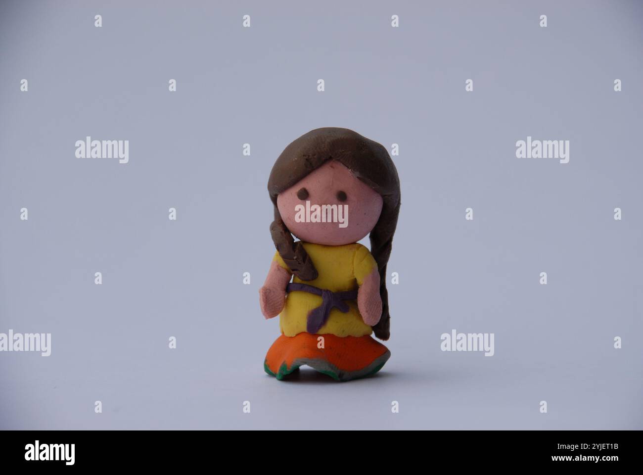 3D rendering in stylized clay of young woman with brown hair and a ...