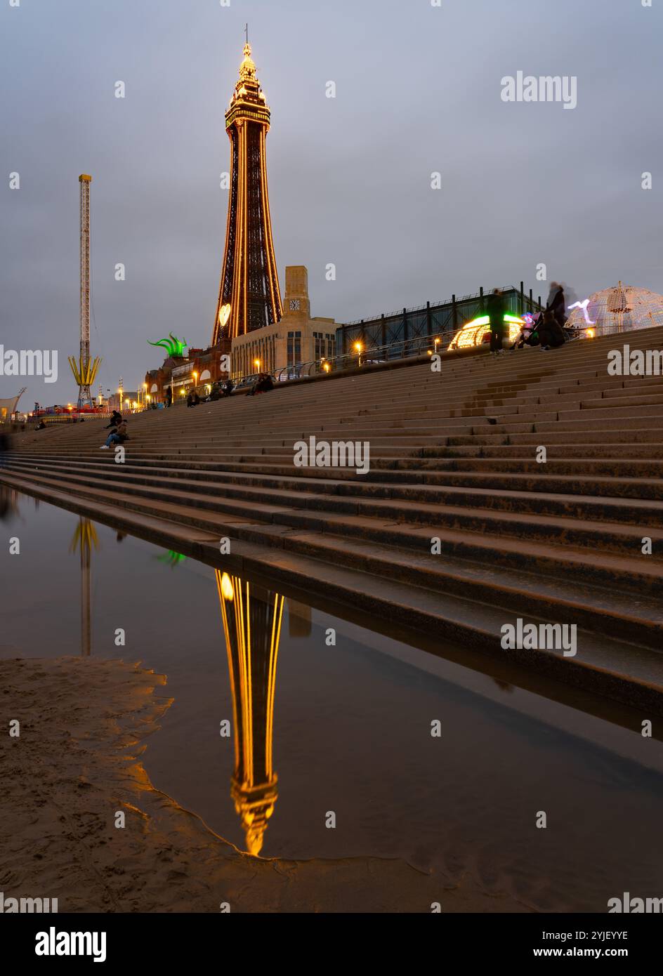 Blackpool Tower at dusk, with reflection in puddle on the Beach ...